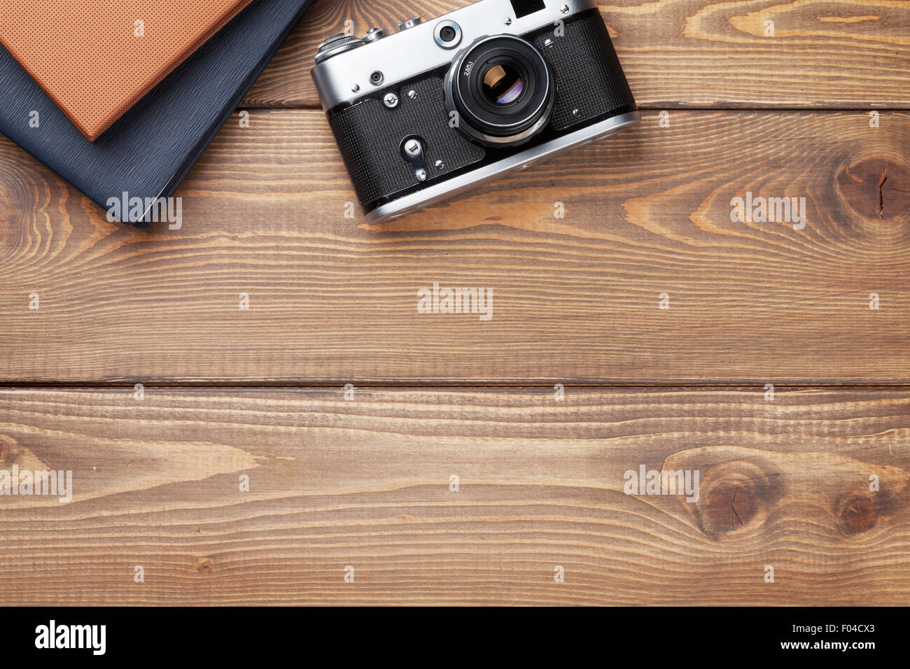 Office desk table with camera and notepad. Top view with copy space ...