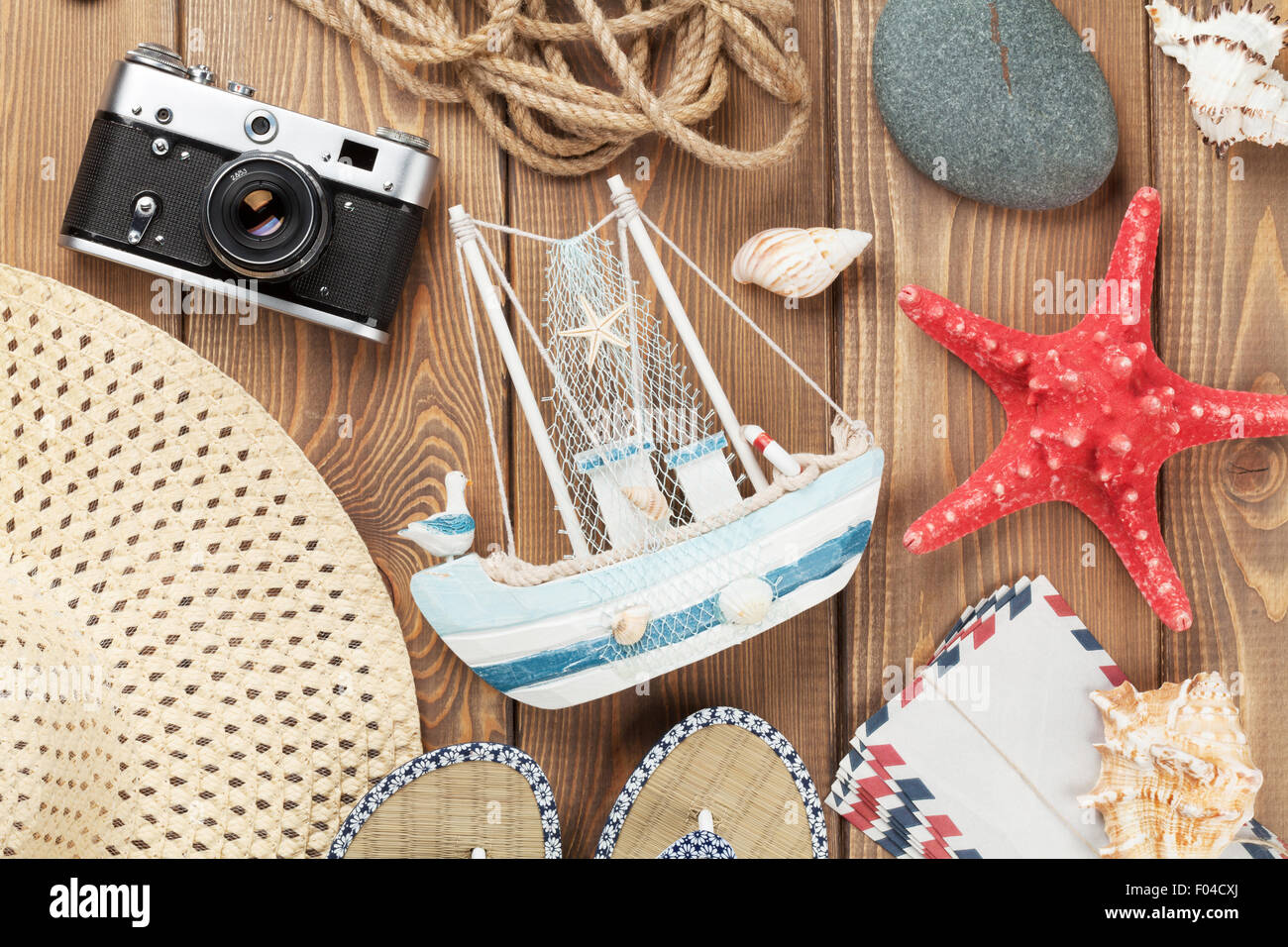 Travel and vacation items on wooden table. Top view Stock Photo - Alamy