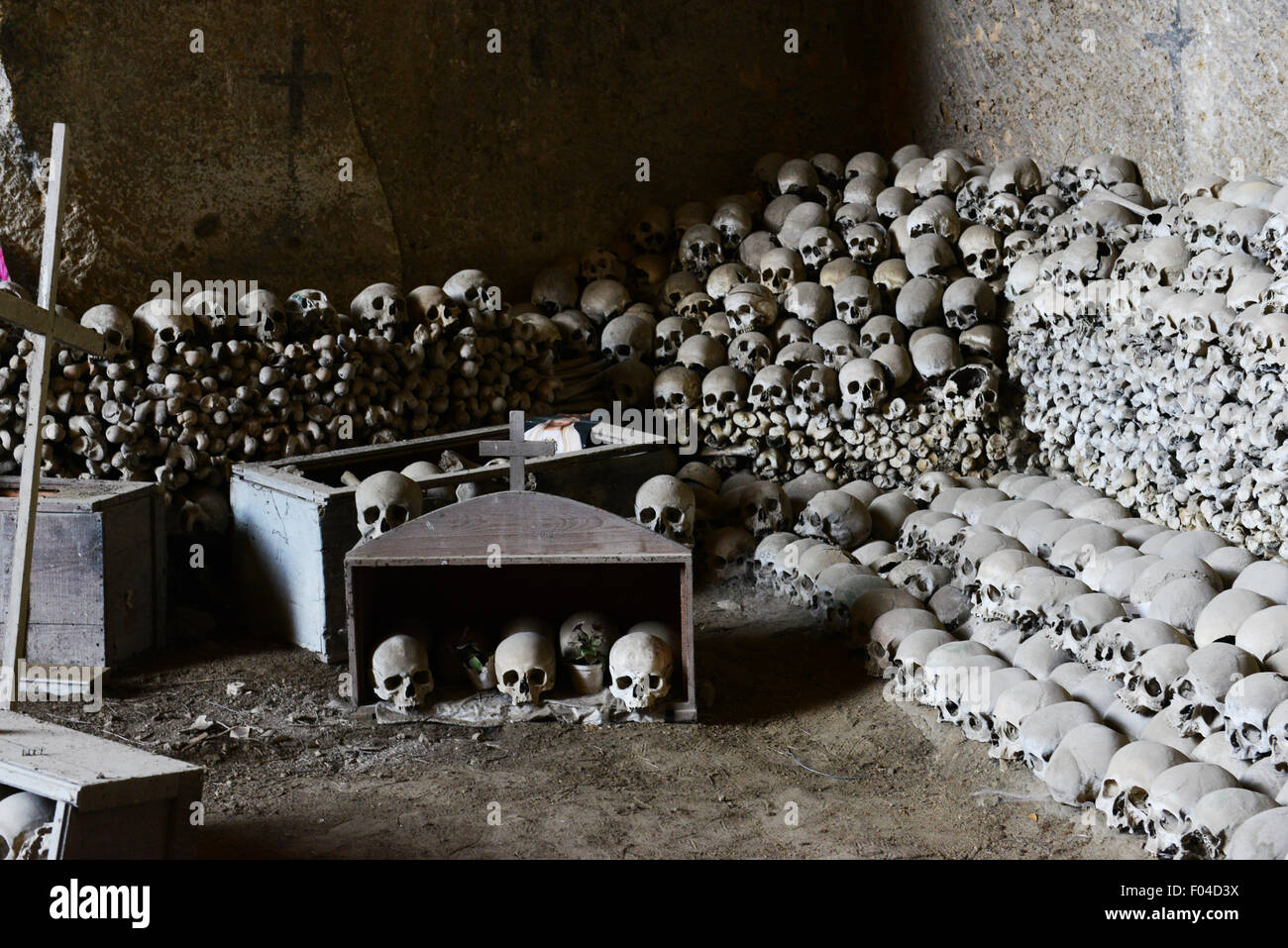 Skulls and bones in the eerie burial cave of Cimitero delle Fontanelle ...