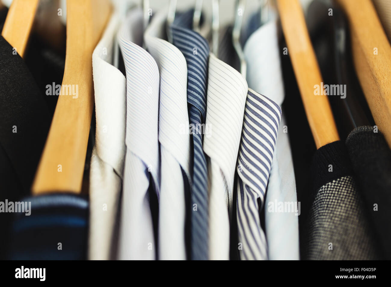 Shirts hanging stack,close up Stock Photo - Alamy