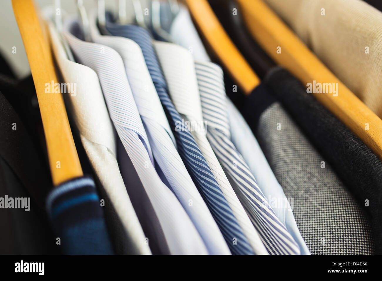 Shirts hanging stack,close up Stock Photo - Alamy