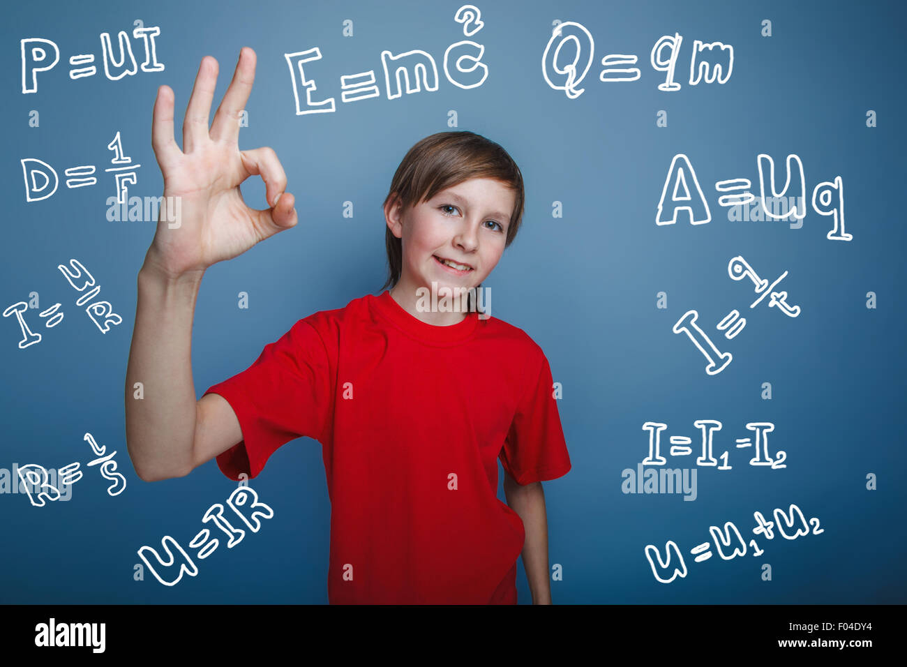 Teenage boy showing OK sign genius physics formulas infographics Stock ...