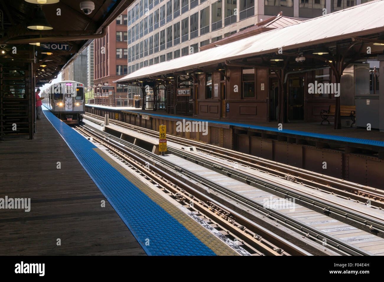 A Chicago L train arriving at Quincy station Stock Photo - Alamy