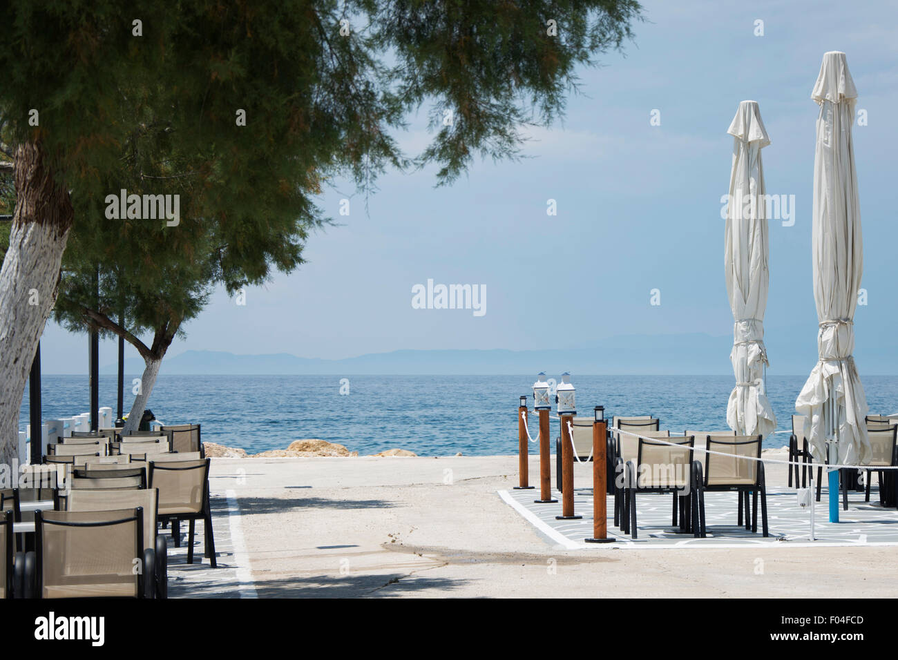 Tables at seaside with an amazing view towards sea Stock Photo - Alamy