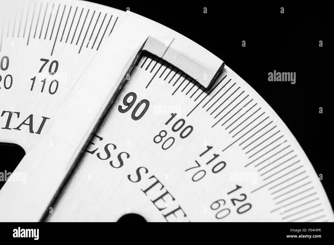 Metal protractor on black background close up photo Stock Photo - Alamy