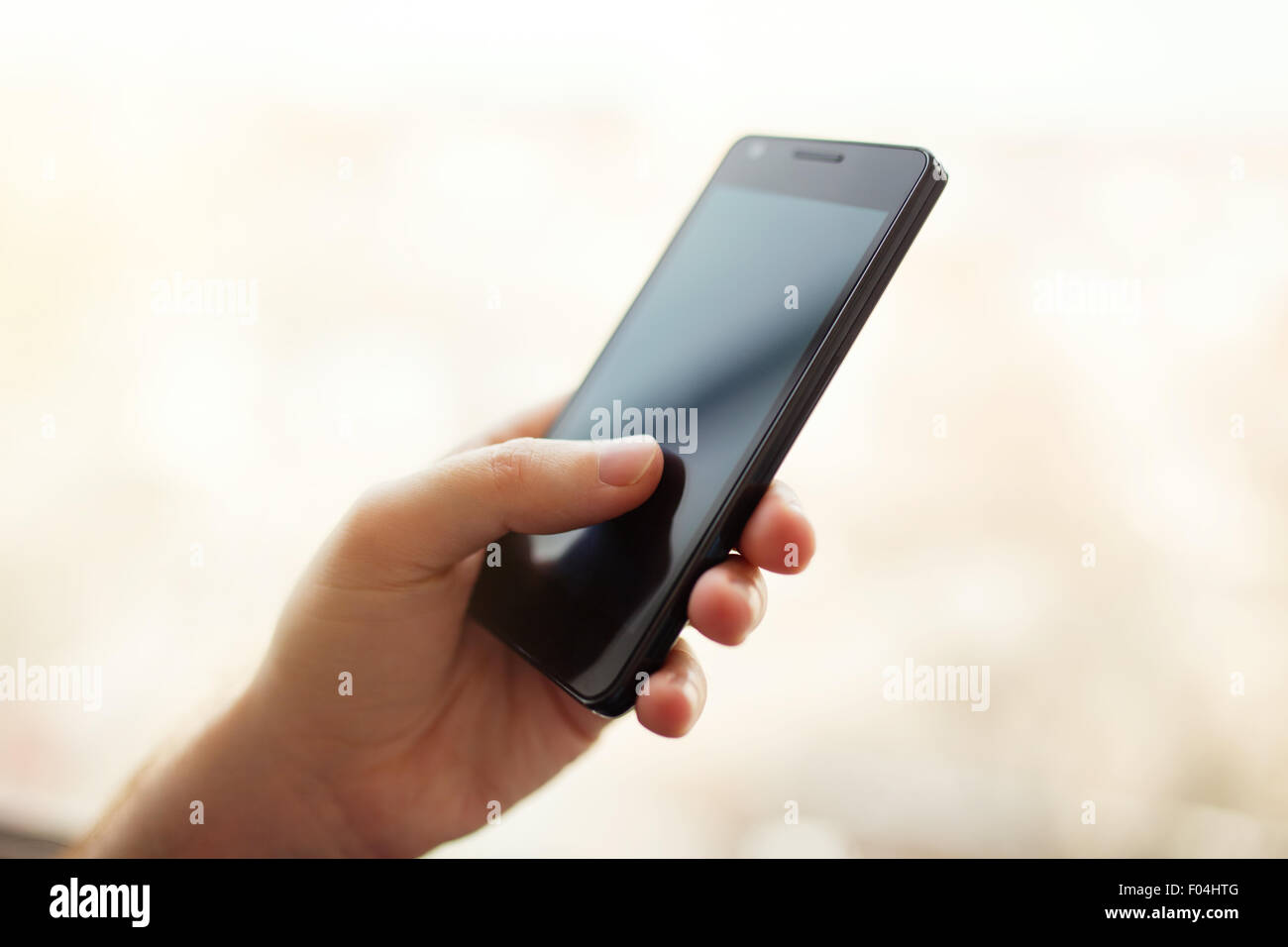 Close up of a man using mobile smart phone outdoor Stock Photo - Alamy