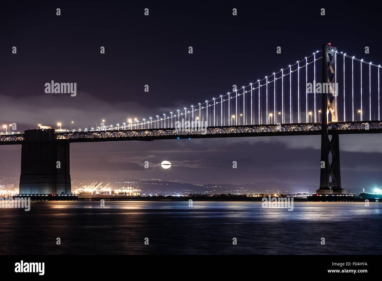 San Francisco-Oakland Bay Bridge at night with the moon Stock Photo - Alamy