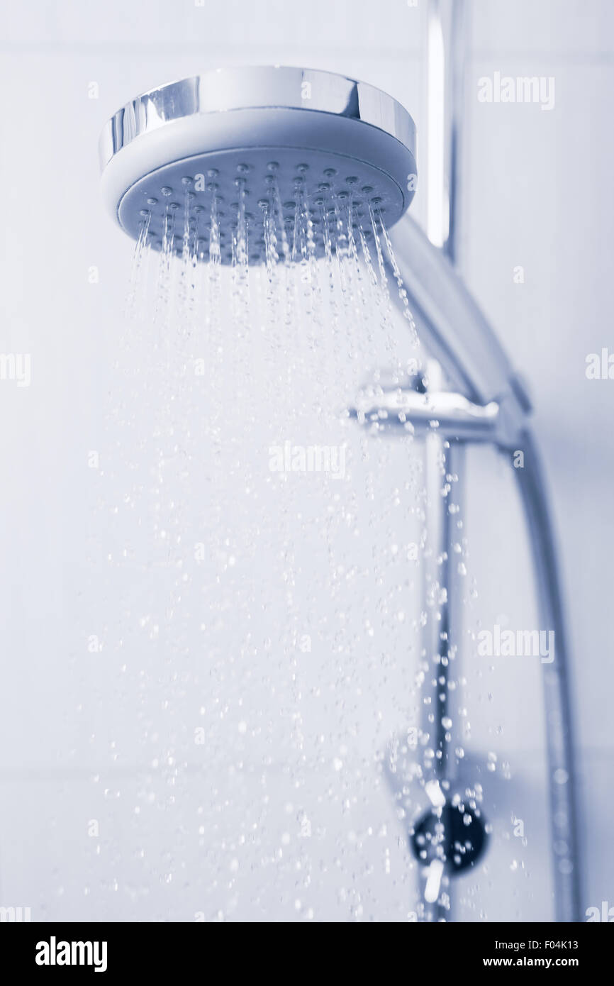 Shower with running water, tinted photo Stock Photo - Alamy