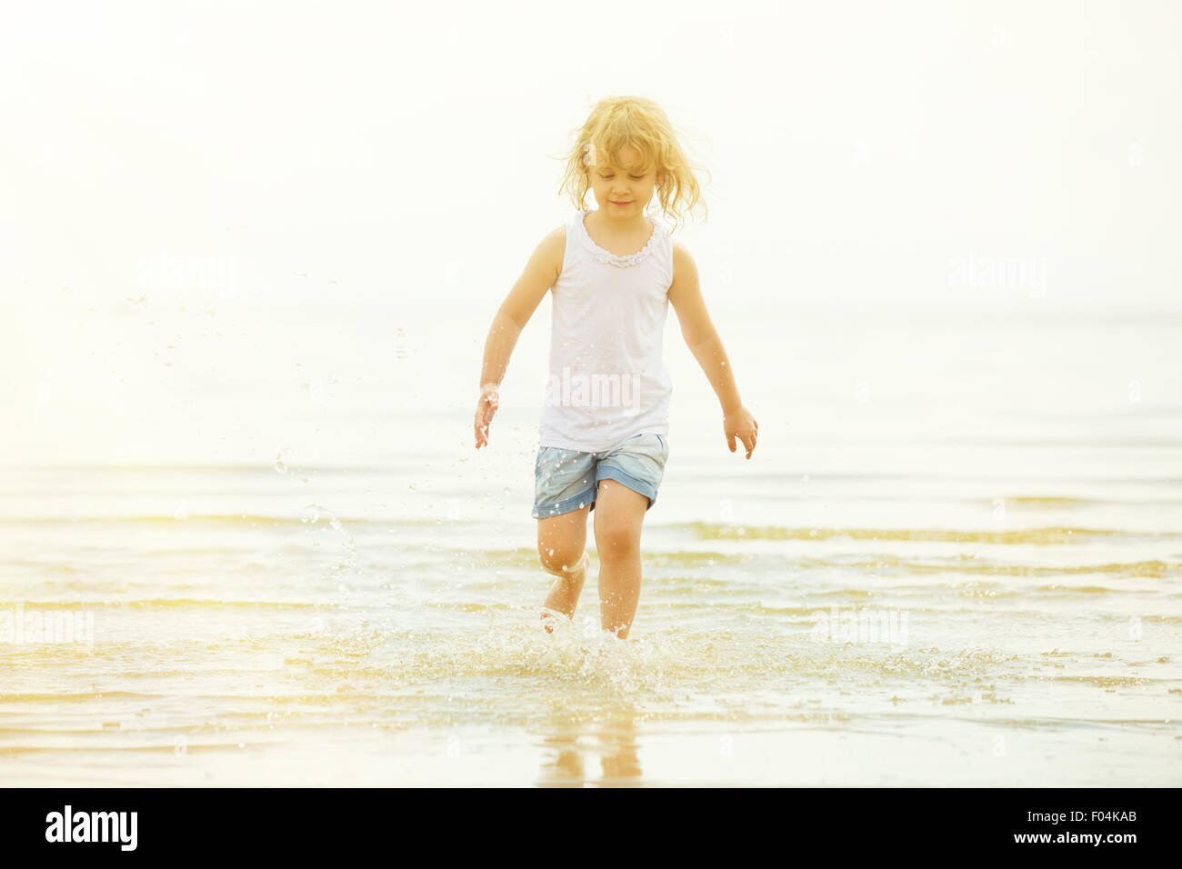 Child jumping to the water hi-res stock photography and images - Alamy