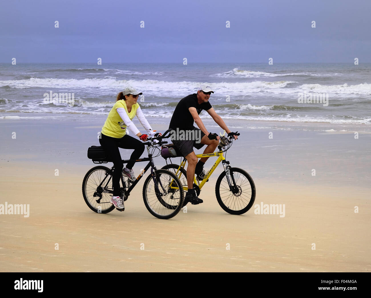 Woman bicycling beach hi-res stock photography and images - Alamy