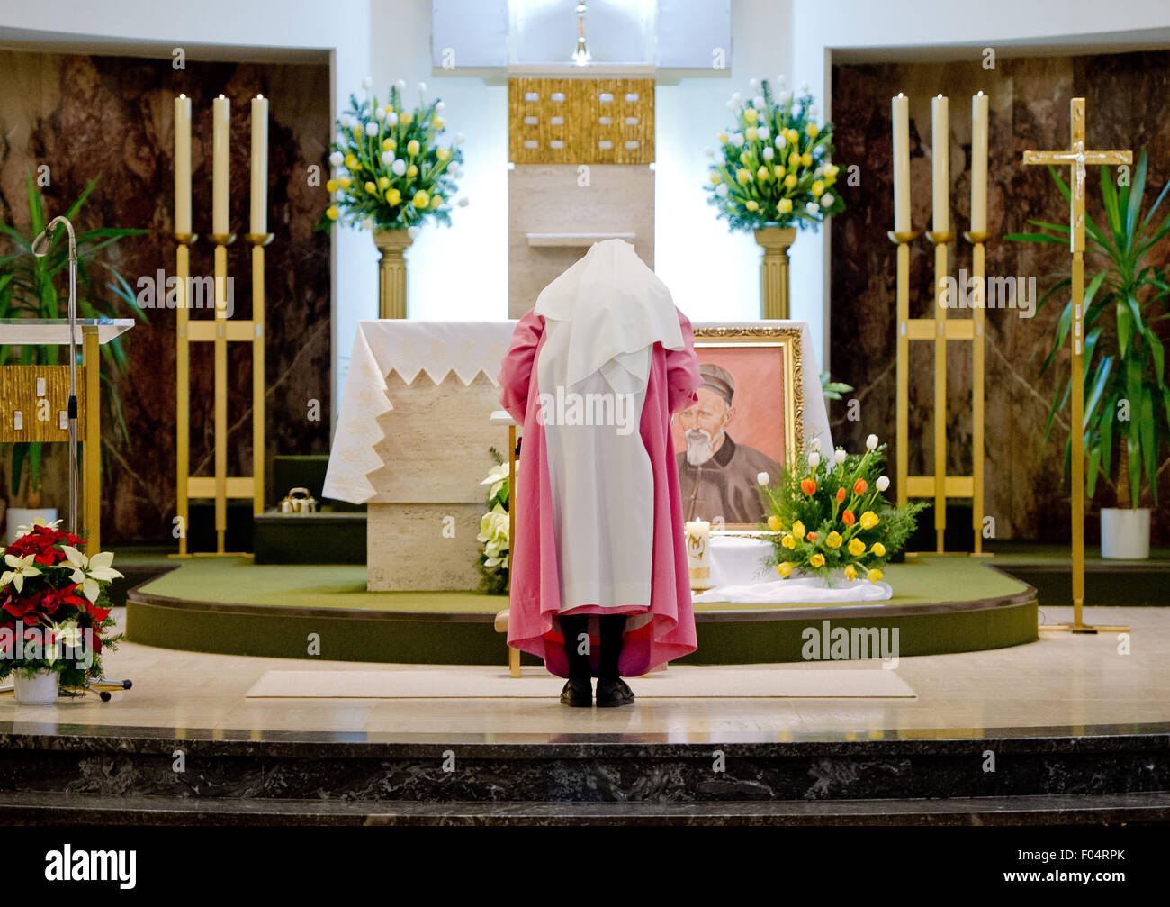 Berlin, Germany. 29th Jan, 2015. A nun prays in the church at the ...