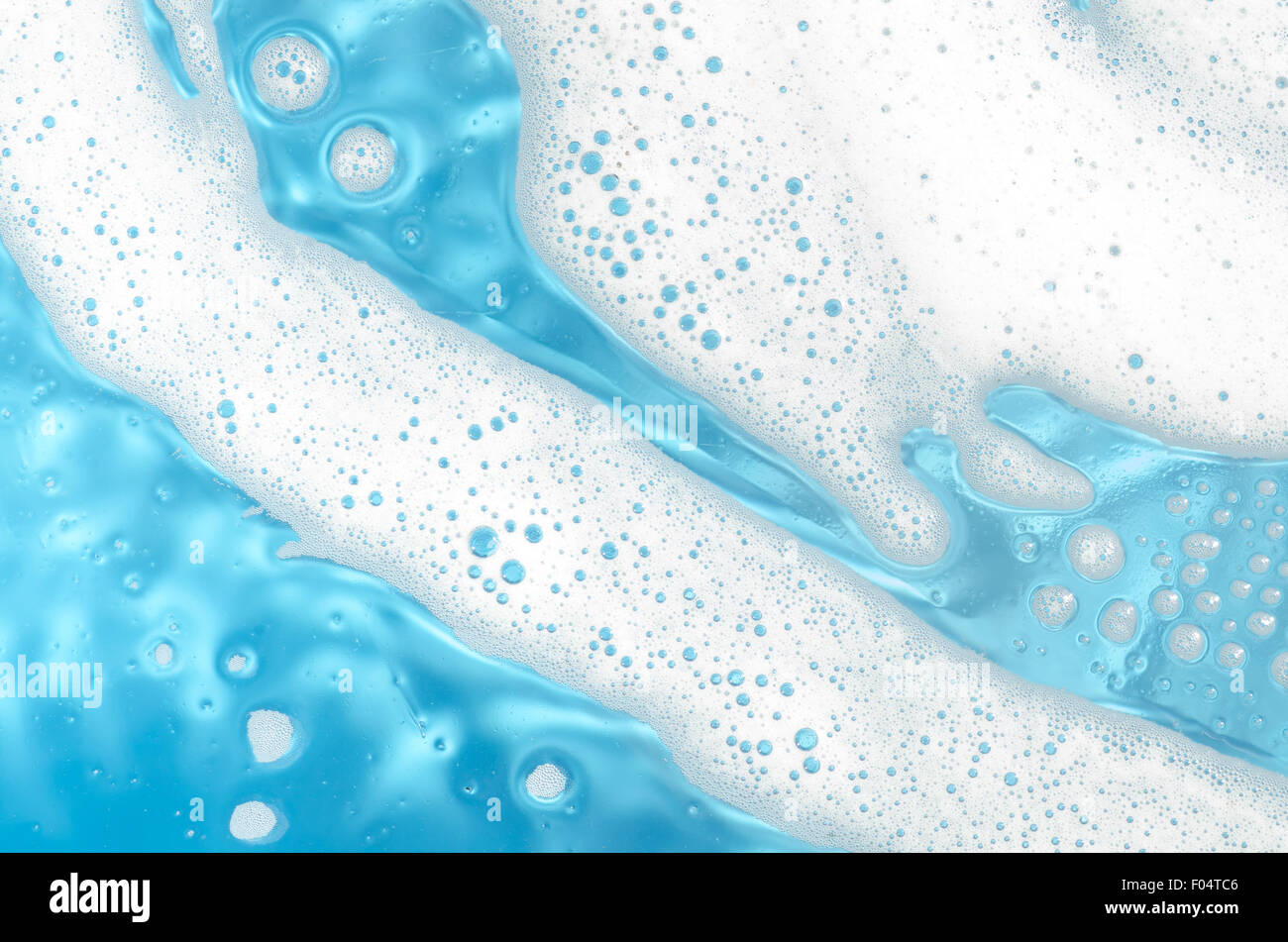 closeup to foam on window glass blue background Stock Photo - Alamy
