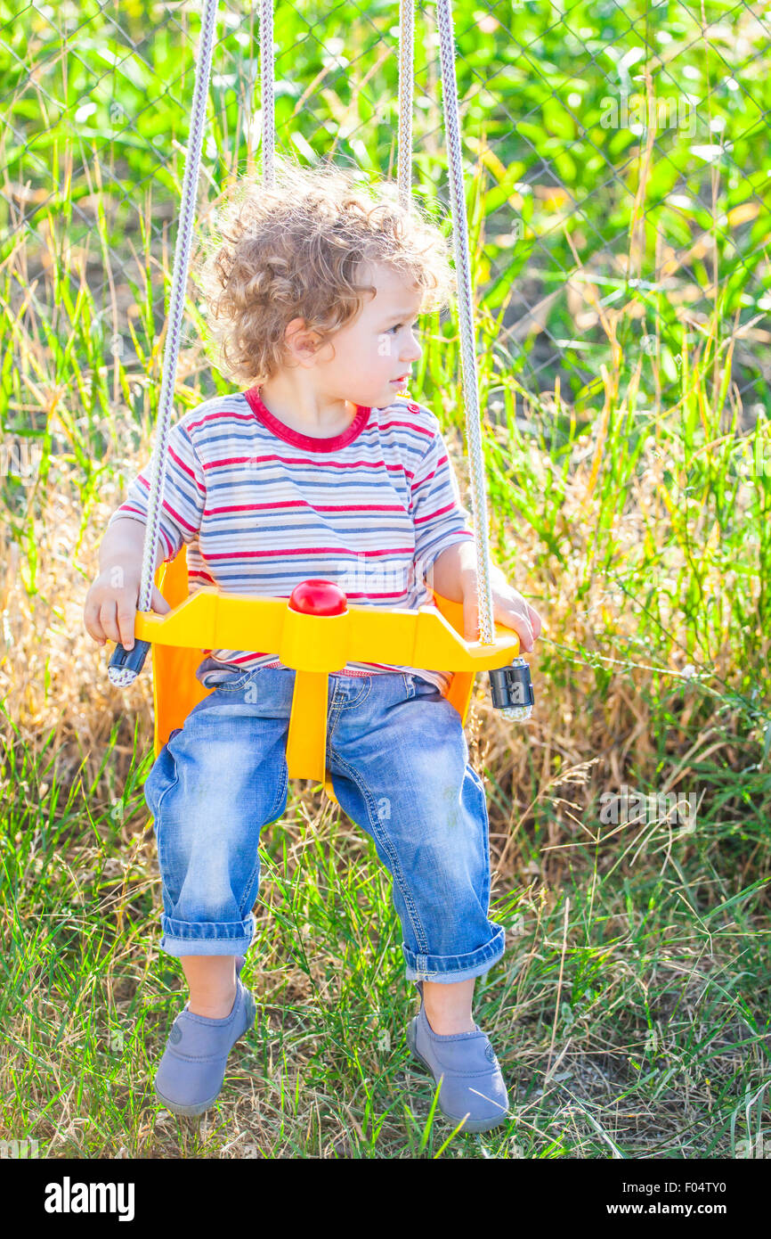 Portrait Of 1 Year Old Baby Boy Playing In A Swing Stock Photo Alamy portrait-of-1-year-old-baby-boy-playing-in-a-swing-stock-photo-alamy