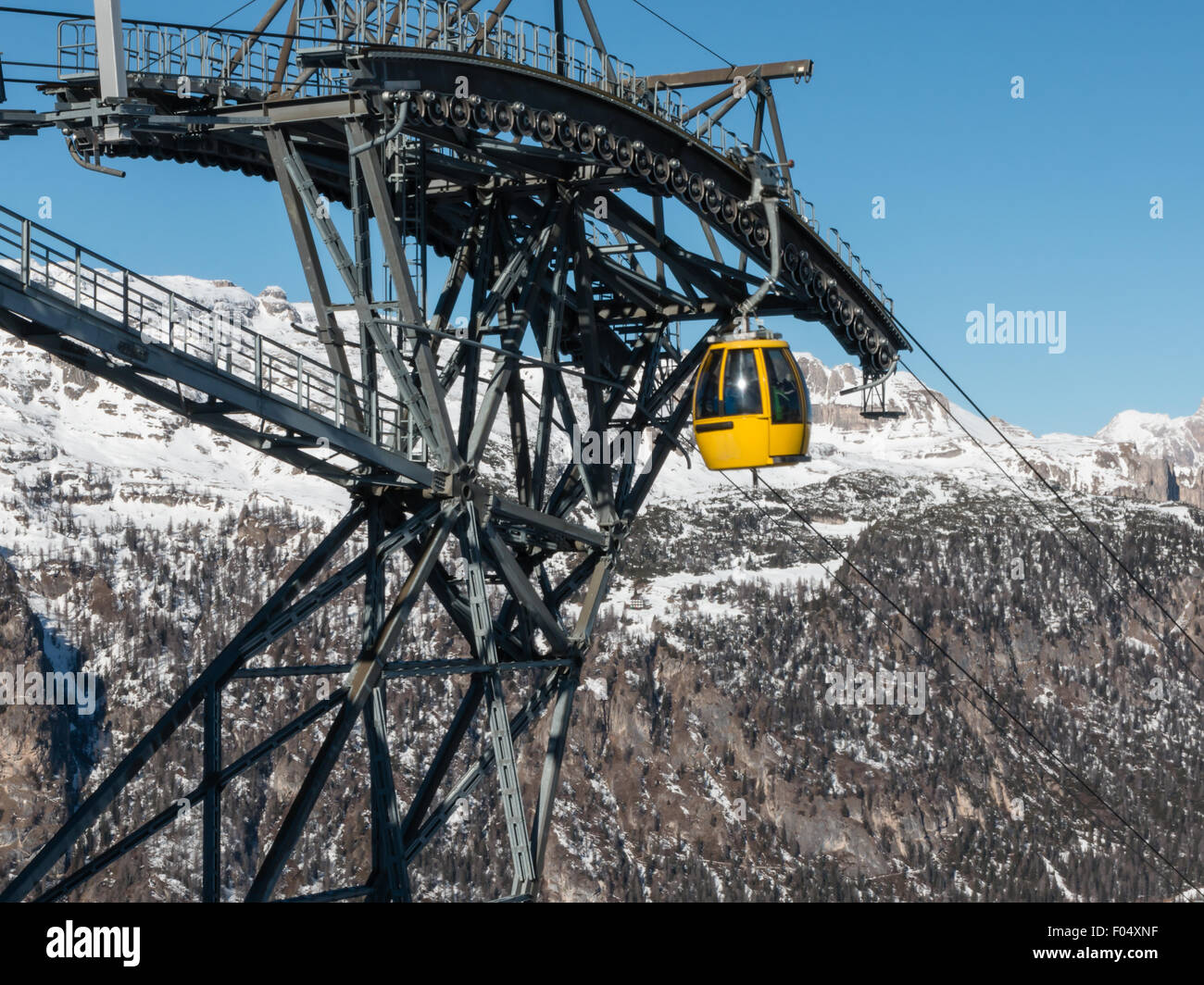 yellow cable car ski lift going up on the mountain top Stock Photo - Alamy