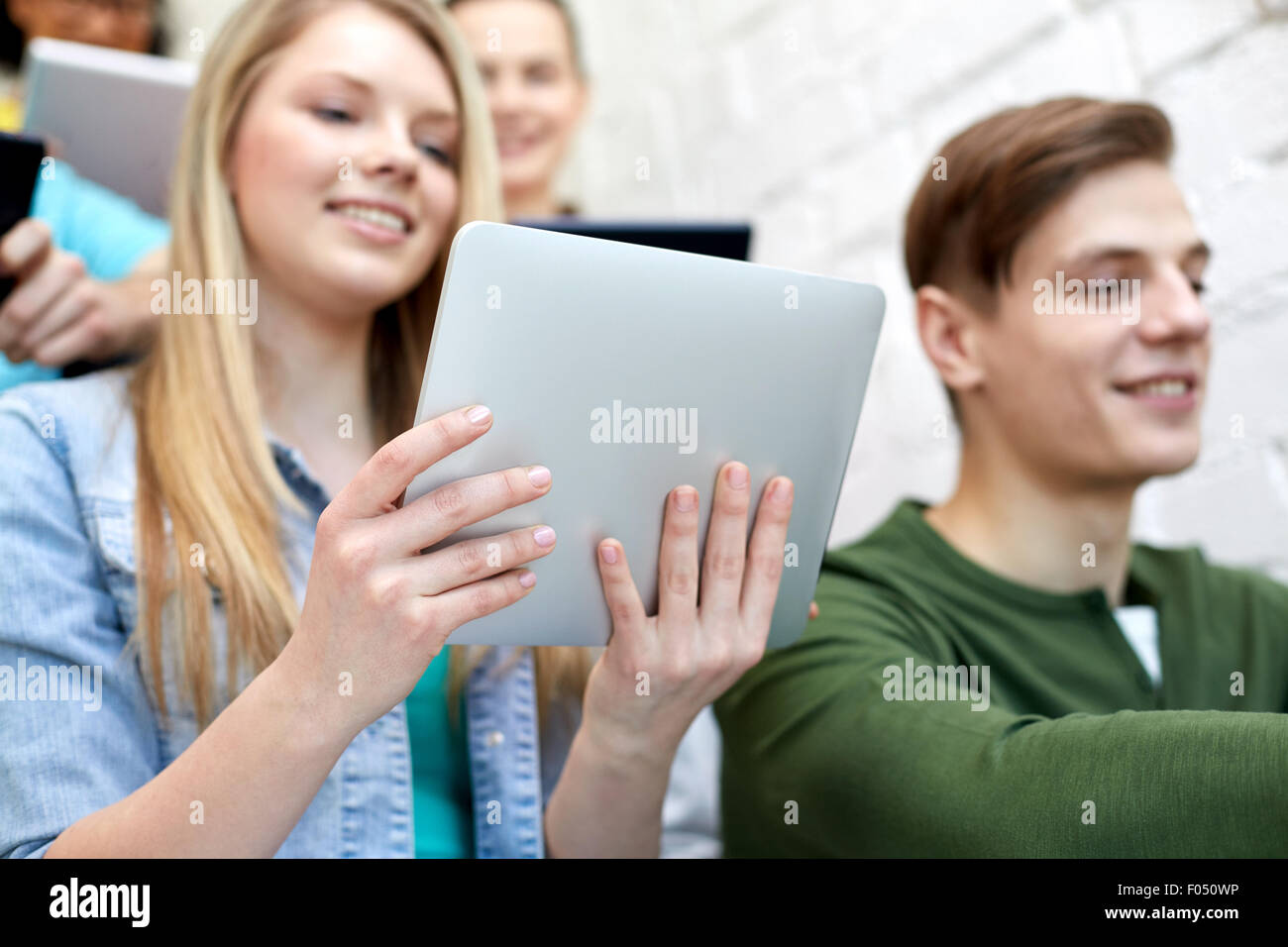 close up of students with tablet pc at school Stock Photo - Alamy