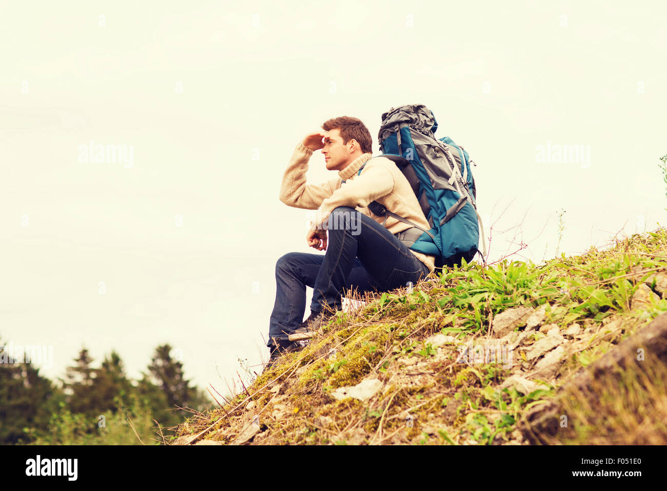 man with backpack hiking Stock Photo - Alamy