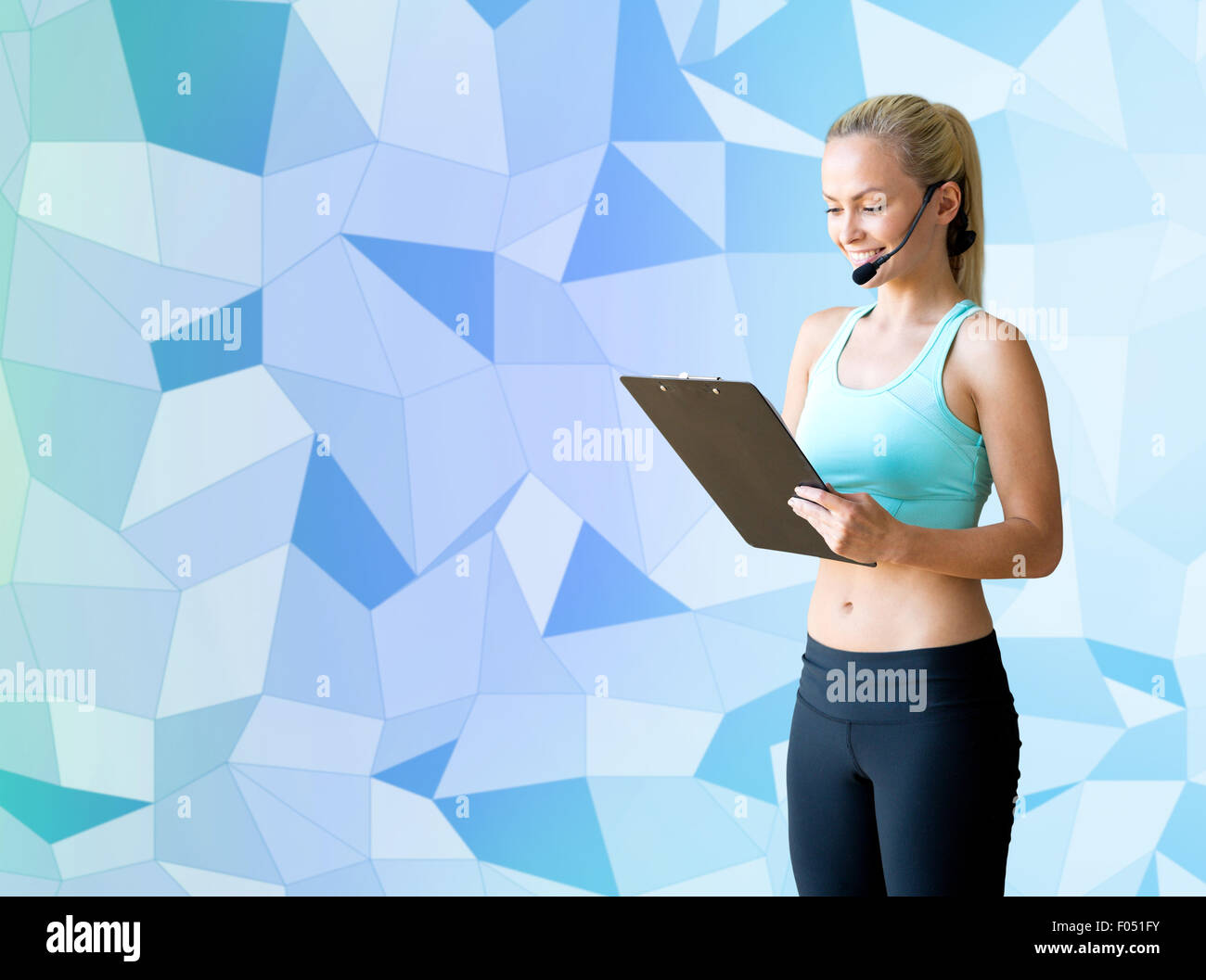 happy woman trainer with microphone and clipboard Stock Photo - Alamy