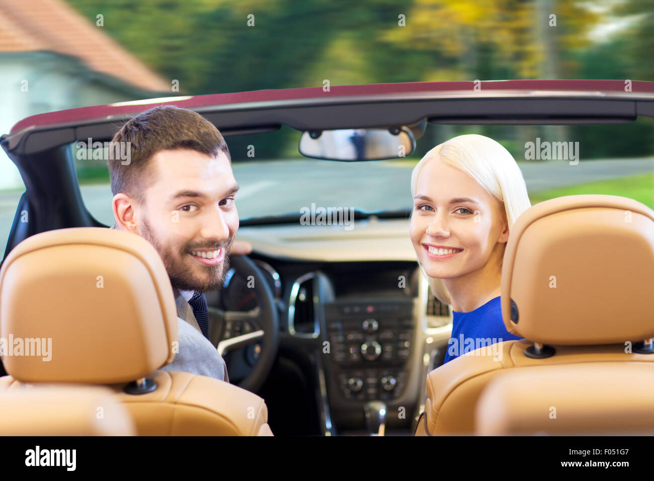 happy couple driving in cabriolet car over city Stock Photo - Alamy