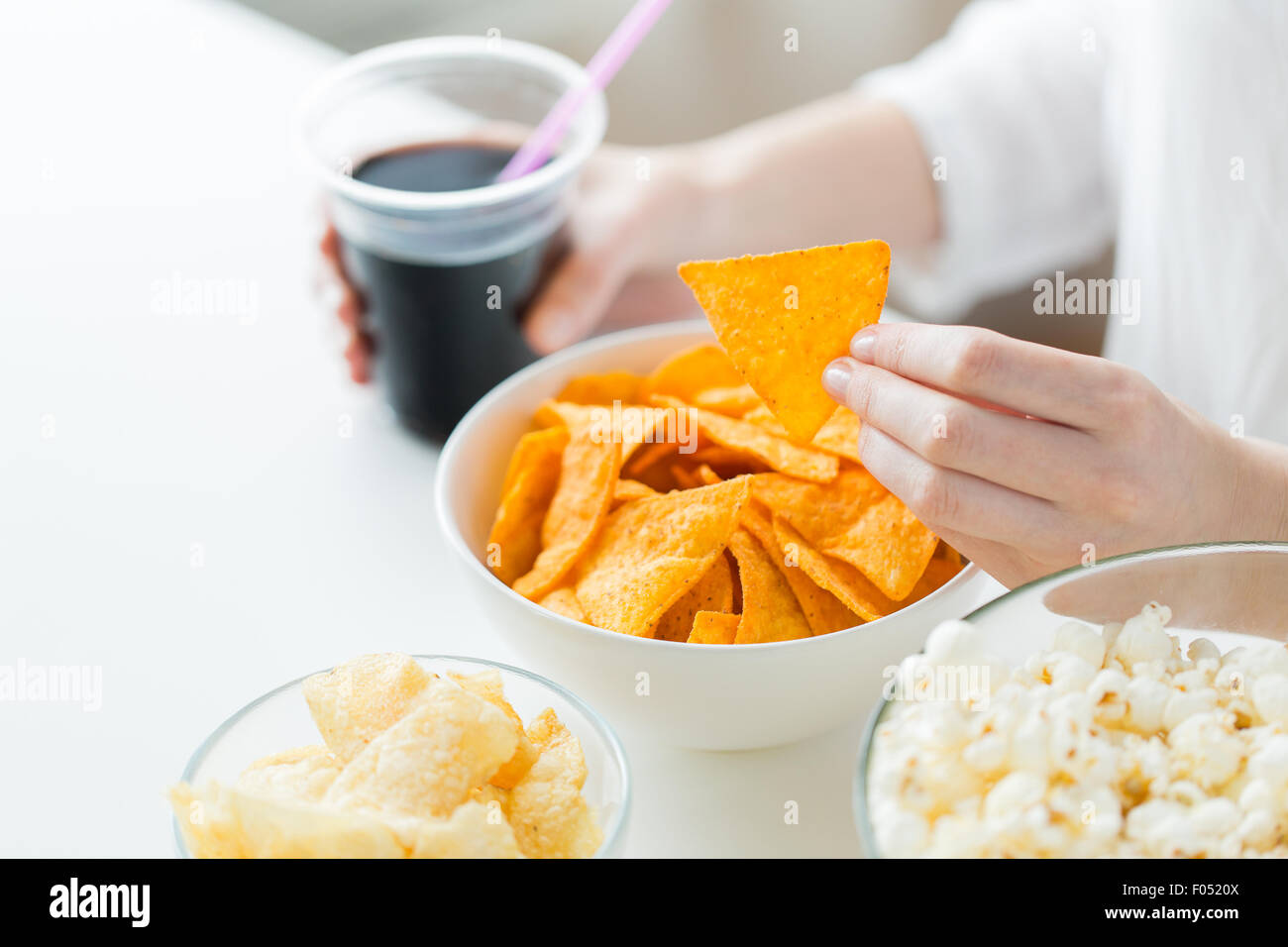 close up of woman with junk food and coca cola cup Stock Photo - Alamy