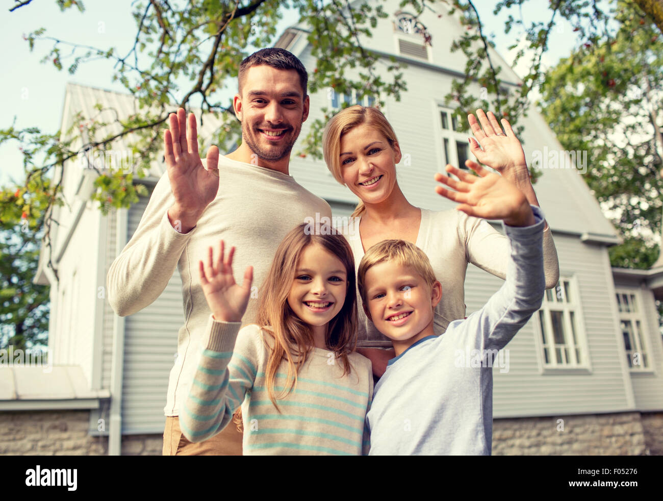 happy family in front of house outdoors Stock Photo - Alamy