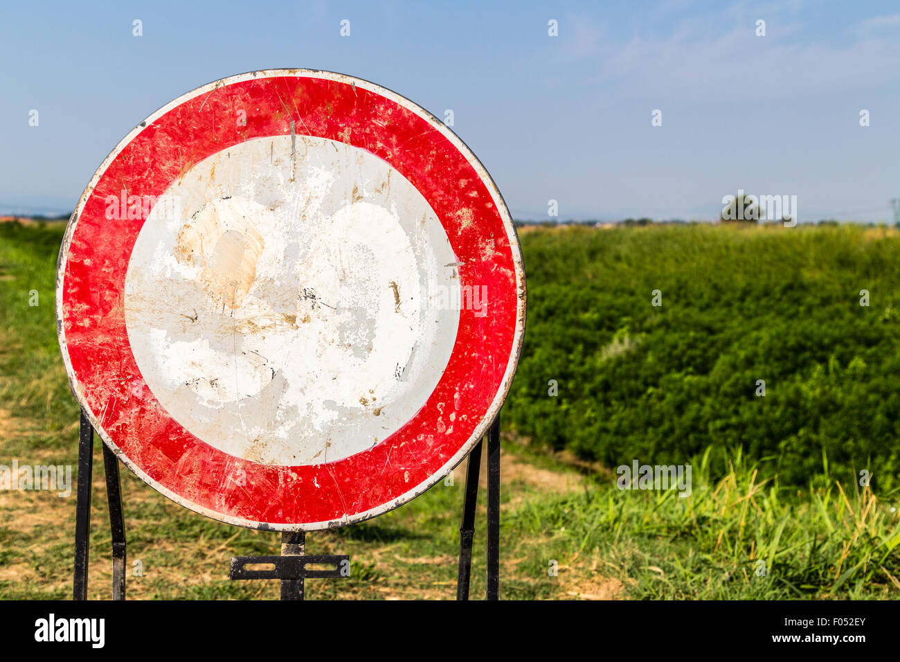 traffic signs and country roads - a faded speed limit 30 mph sign ...