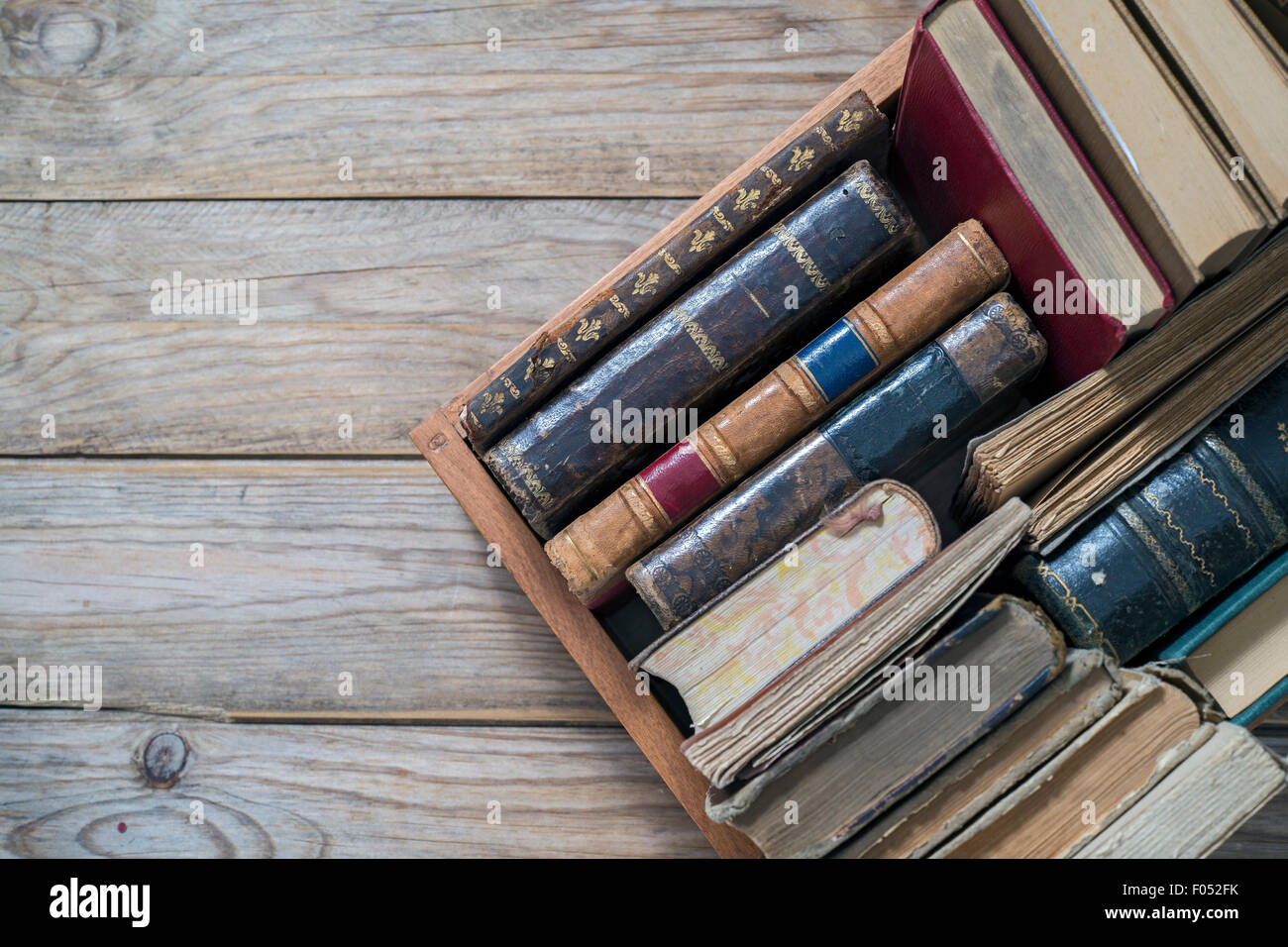 Old books in the wooden box Stock Photo - Alamy