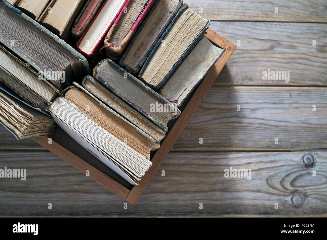 Old books in the wooden box Stock Photo - Alamy