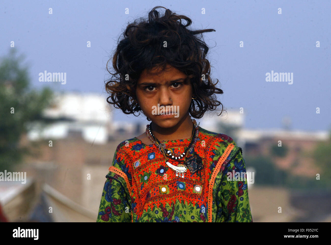 Peshawar. 7th Aug, 2015. An Afghan refugee girl poses for a photo at a ...
