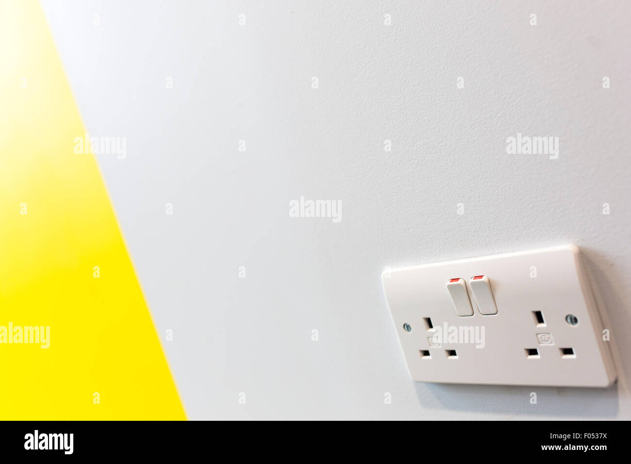 double plug socket on an office wall Stock Photo - Alamy