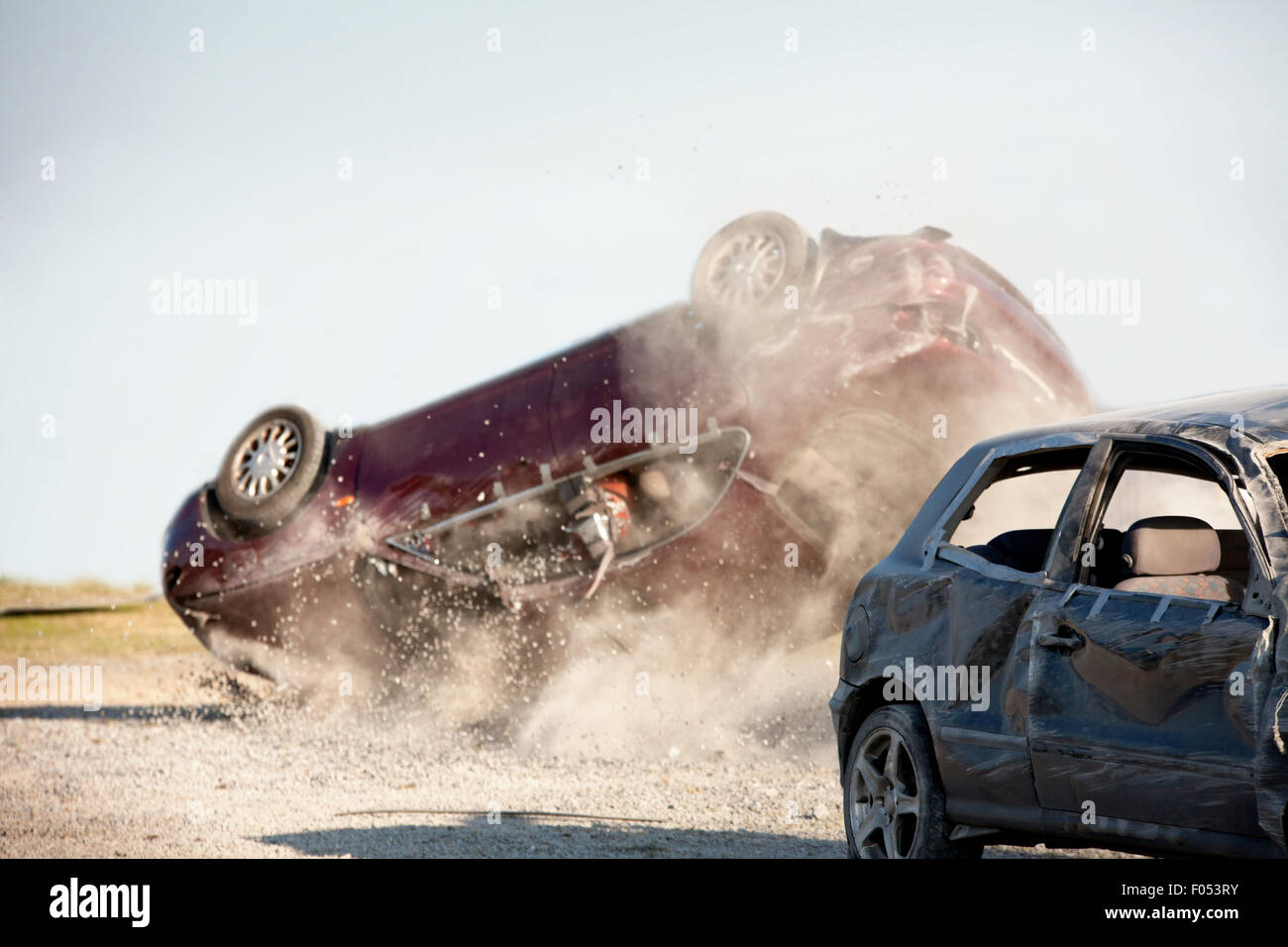 two cars turned upside-down after road collision Stock Photo - Alamy
