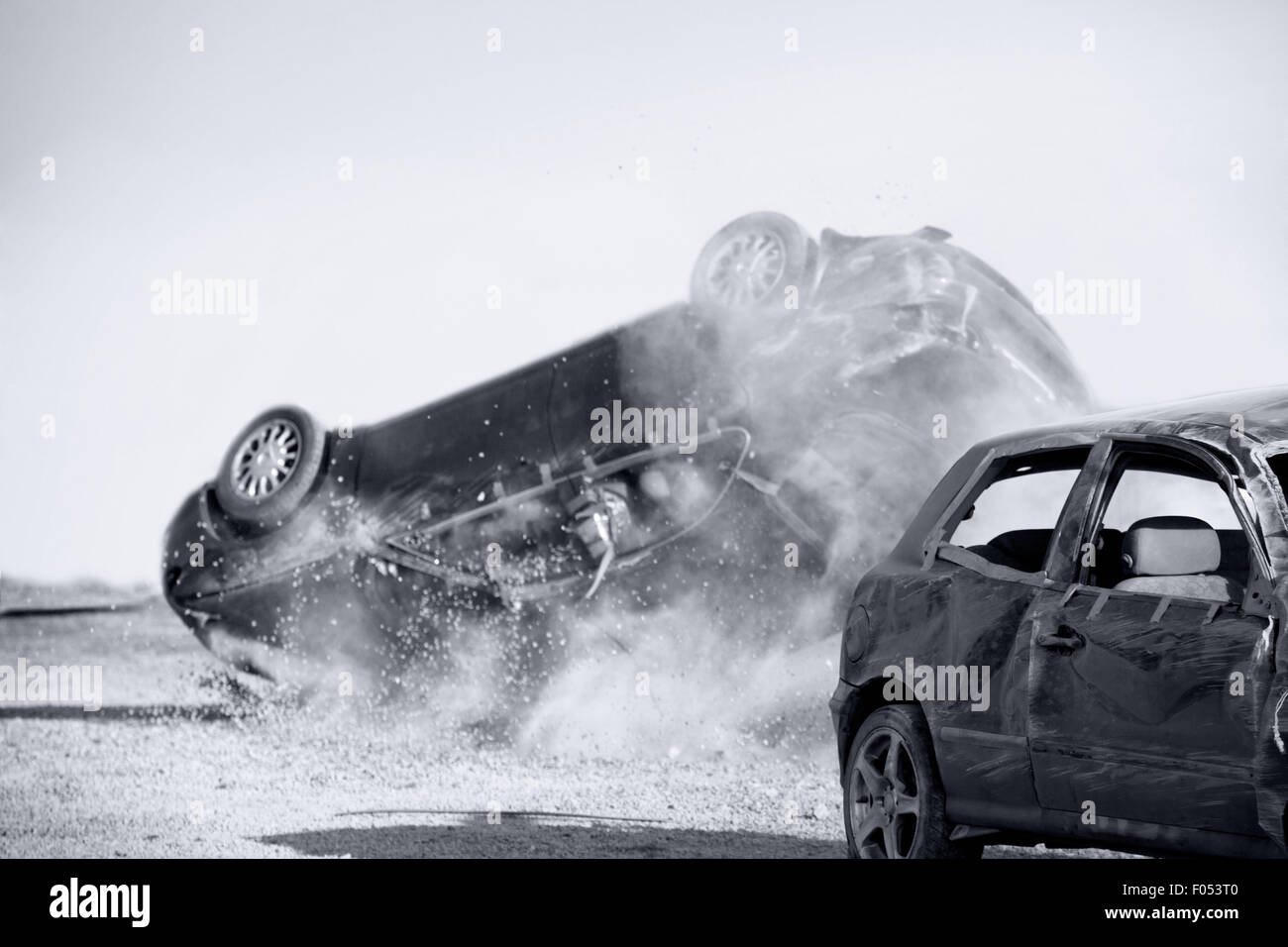 two cars turned upside-down after road collision, monochromatic Stock ...