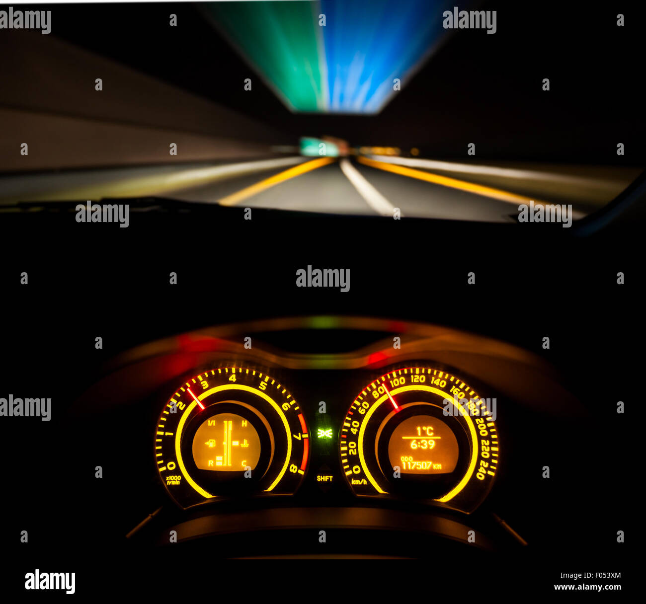 Driver view at speeding car dashboard and motorway at night Stock Photo ...