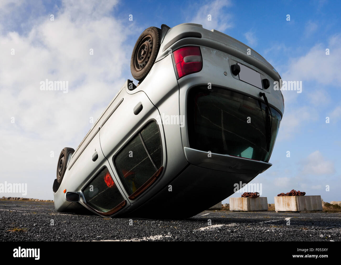 car turned upside-down after road collision Stock Photo - Alamy