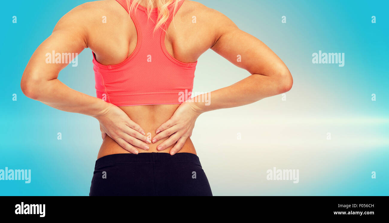 close up of sporty woman touching her back Stock Photo - Alamy