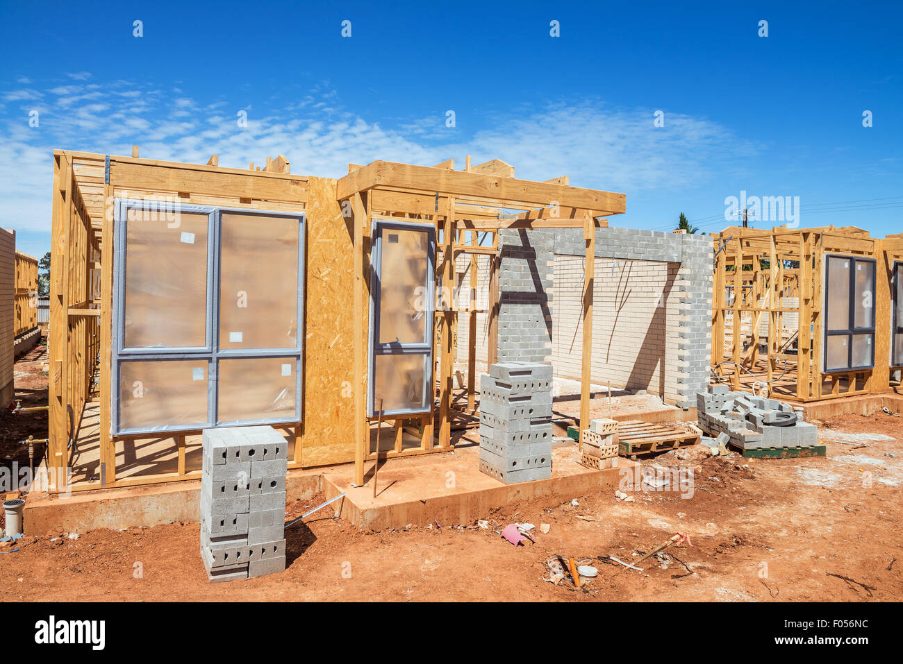 new suburban homes currently under construction in row Stock Photo - Alamy