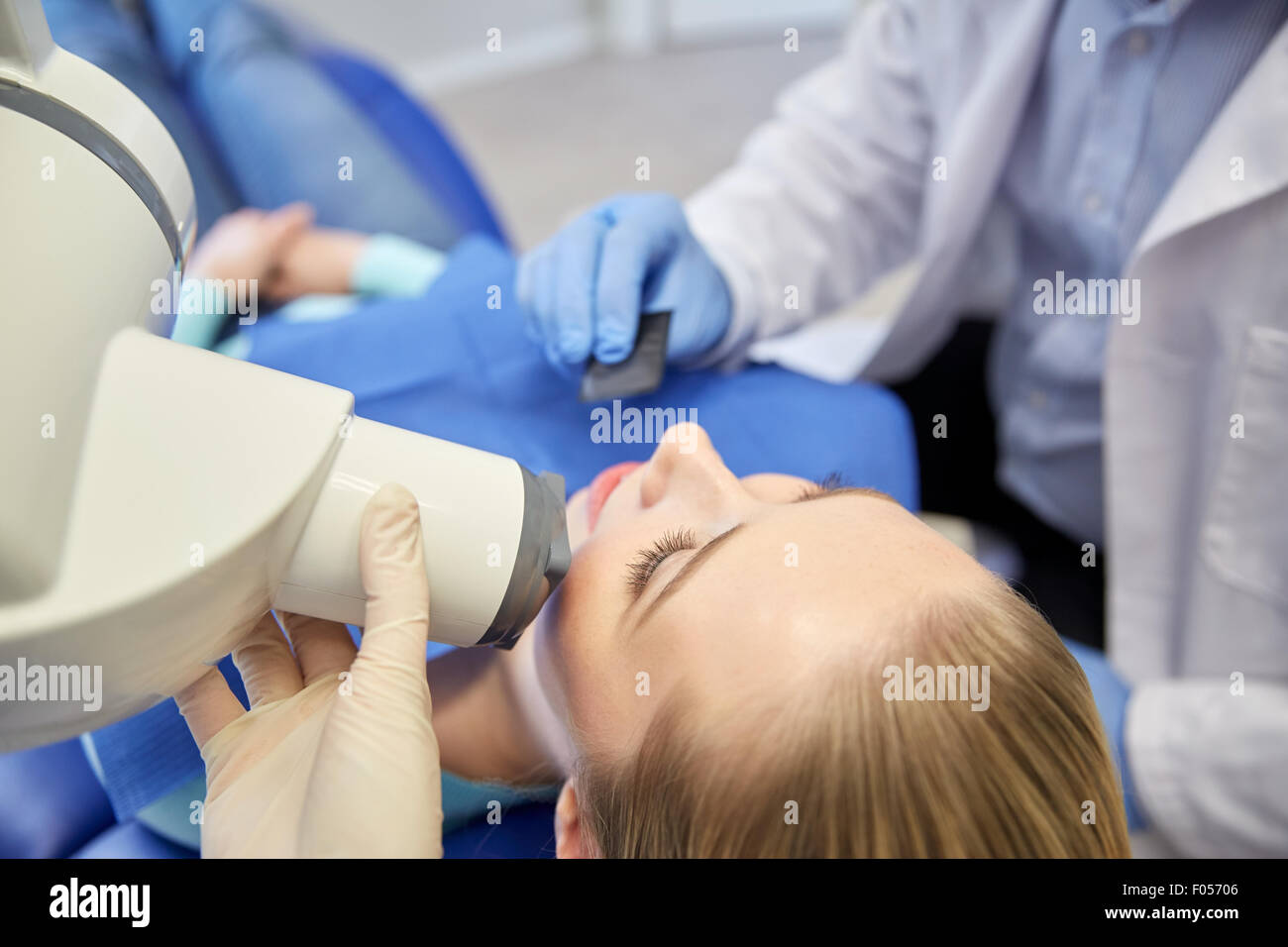 dentist and patient with dental x-ray machine Stock Photo - Alamy
