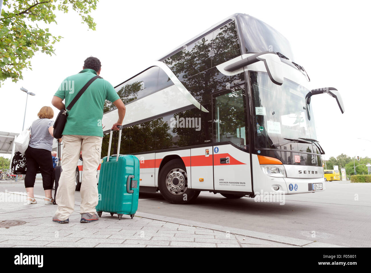 Passengers enter an 'IC Bus' at the train station 'Suedkreuz' in Berlin ...