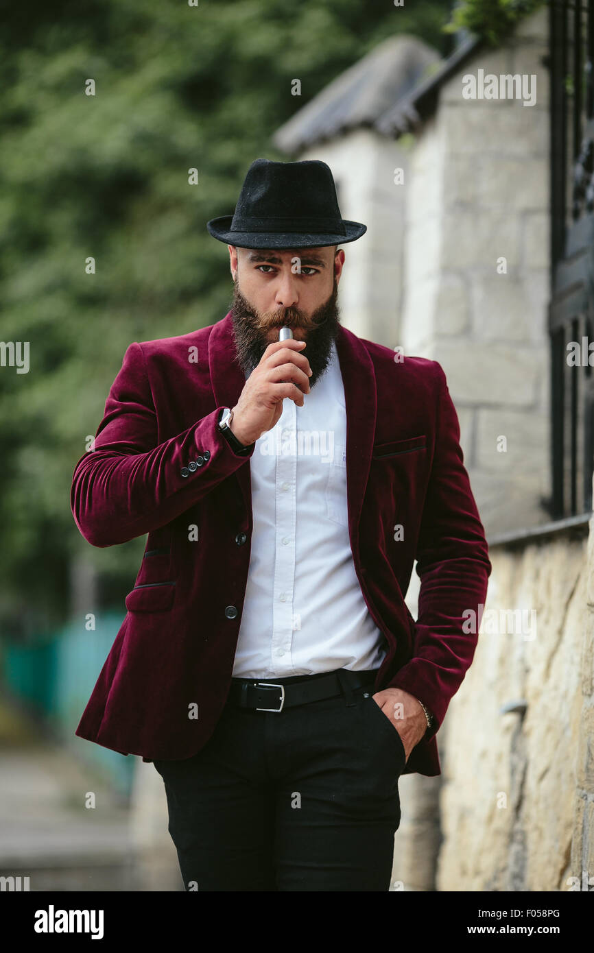 a rich man in a jacket near his house Stock Photo - Alamy