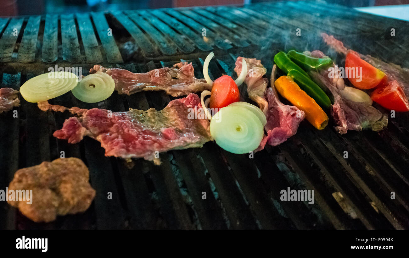 Meat and vegetables char grilled over flame Stock Photo - Alamy