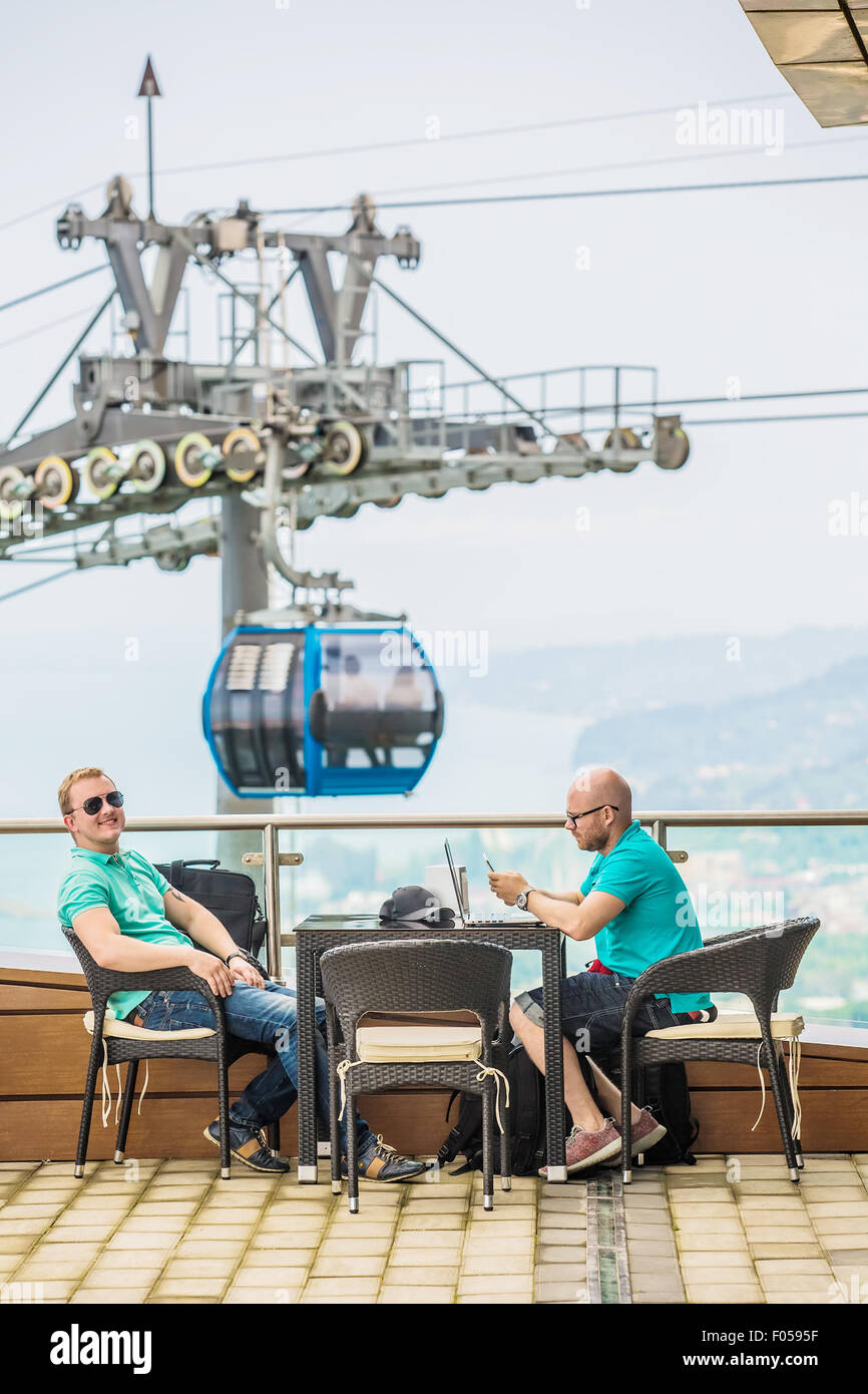 Two friends enjoying together outside at the cafe Stock Photo - Alamy