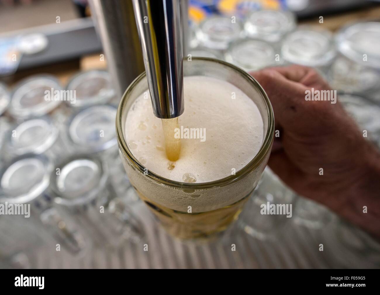 Berlin, Germany. 7th Aug, 2015. A man pulls a beer at the international ...