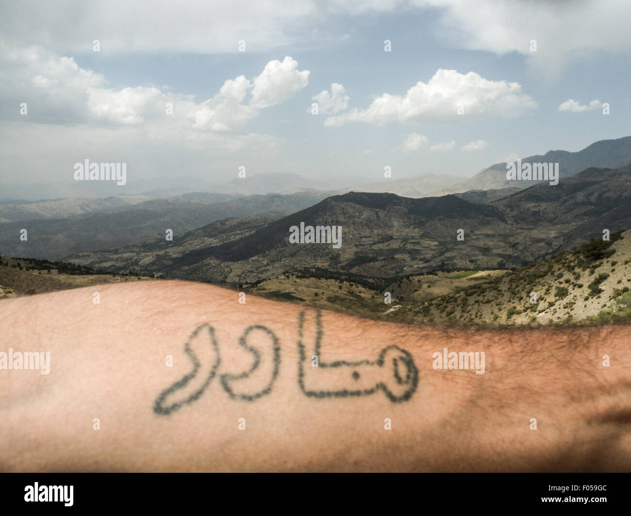 Arbil, Iraq. 07th Aug, 2015. A man shows his tattoo. PDKI movement is ...