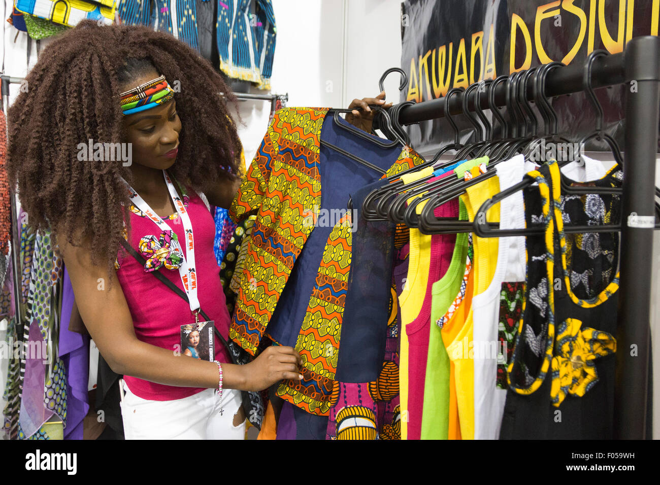 London, UK. 7 August 2015. Fashwa Luke looks after her fashion stall ...