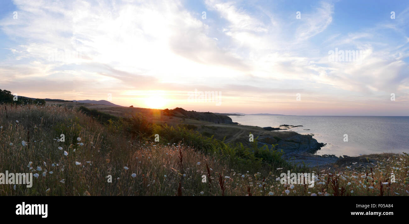 Beautiful sunset over the beach Stock Photo - Alamy