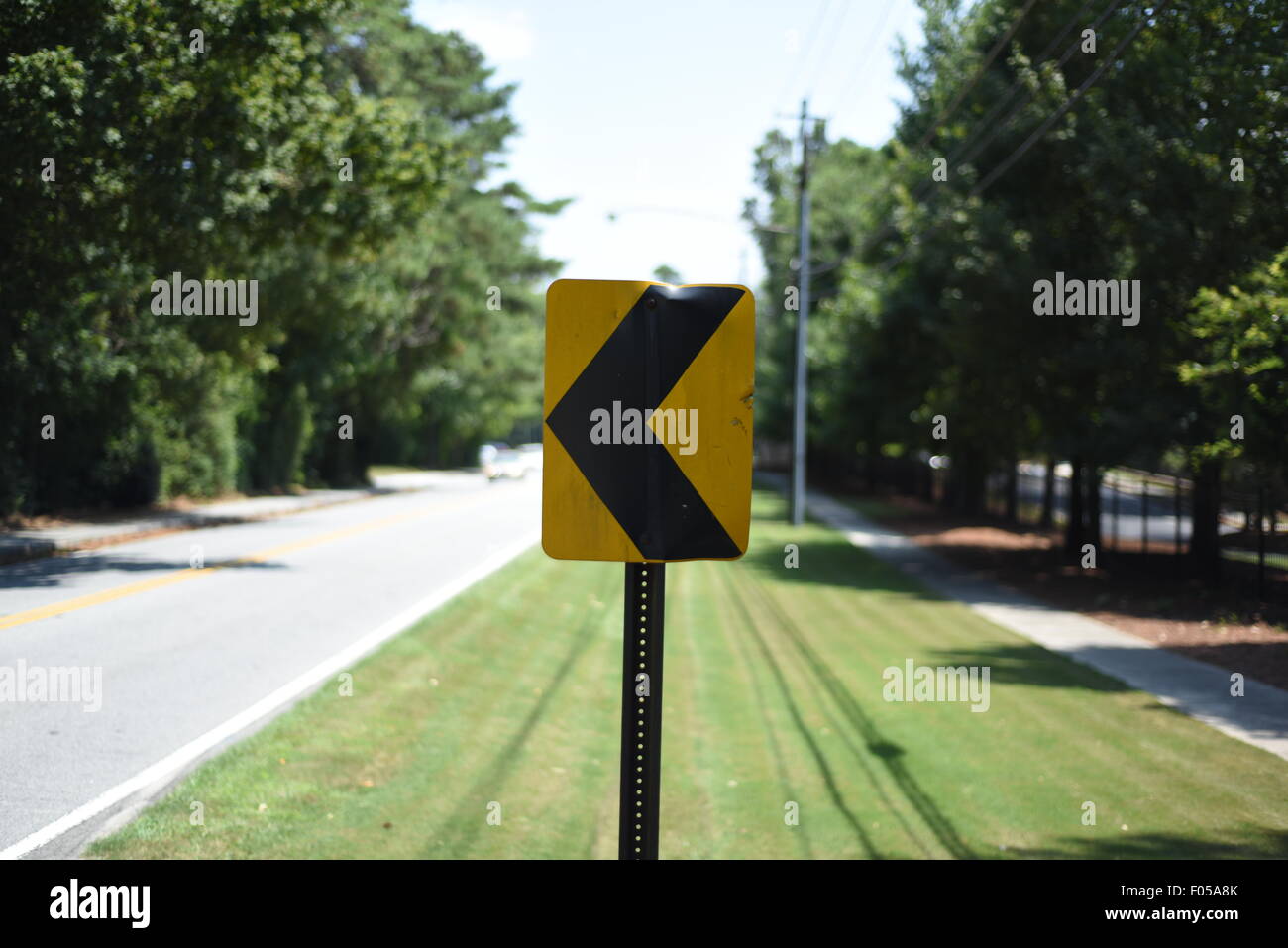 road sign arrow empty road Stock Photo - Alamy