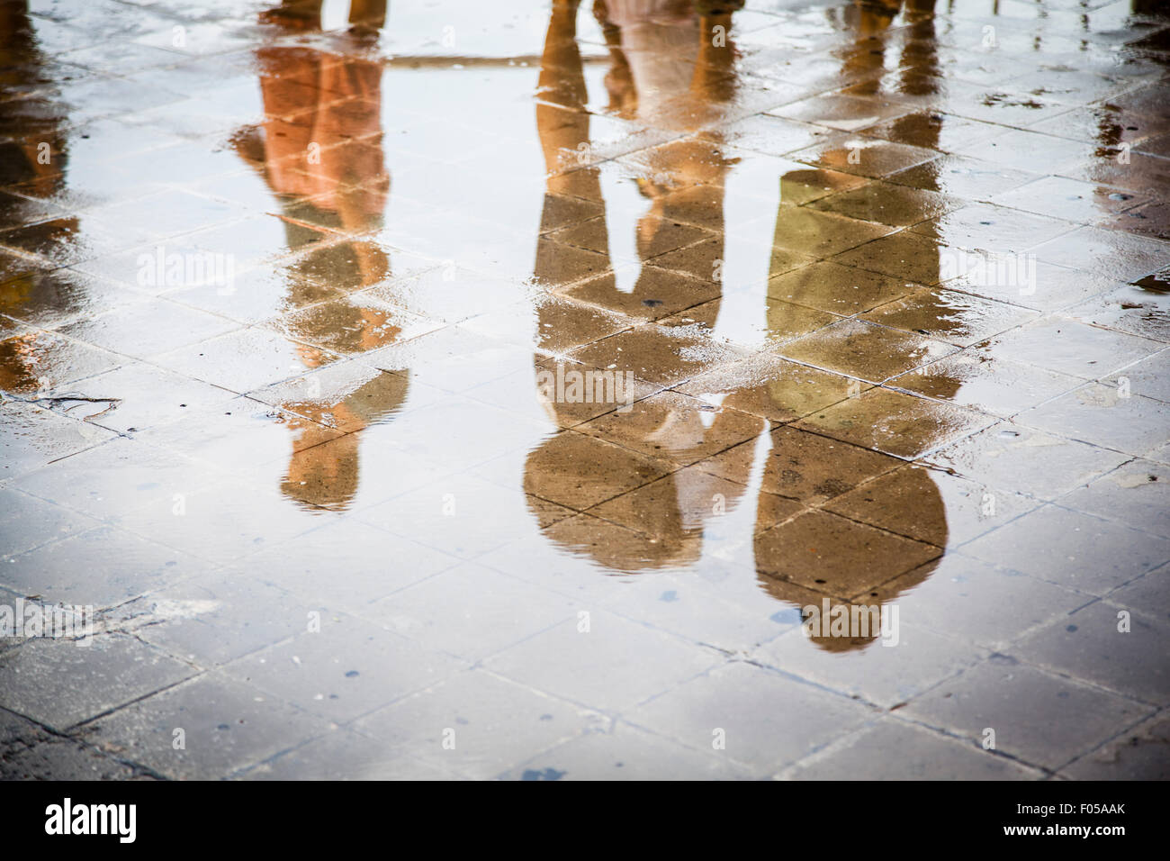 Rainy weather, reflection of tourist Stock Photo - Alamy