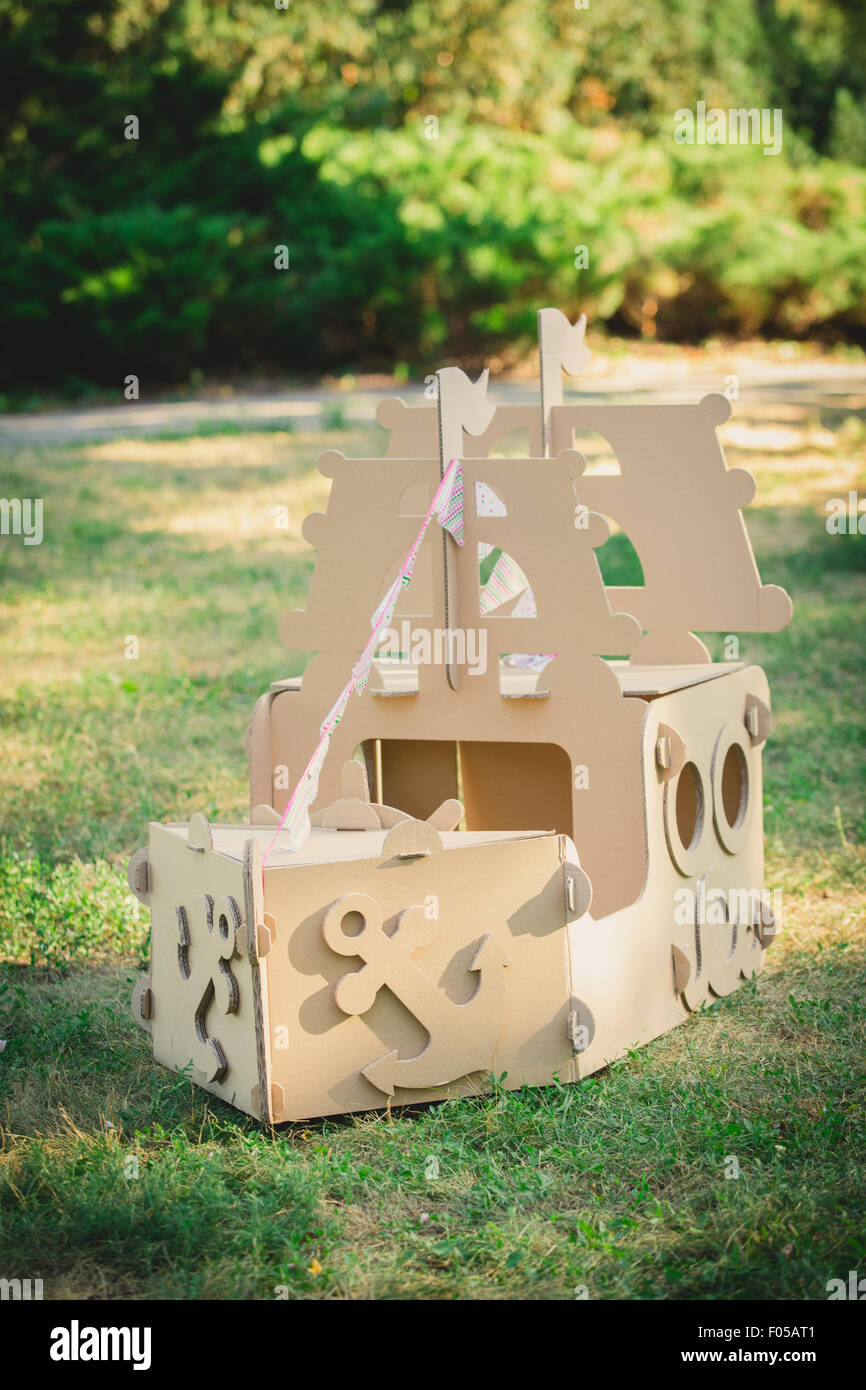 Cardboard toy boat in the park. Eco concept Stock Photo - Alamy