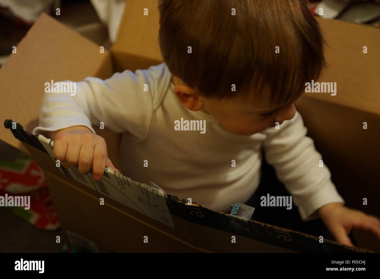 boy coming out of box Stock Photo - Alamy