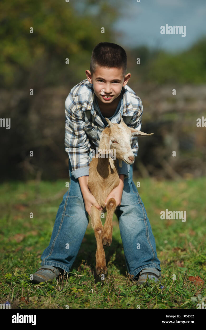 little boy with goat on the farm Stock Photo - Alamy