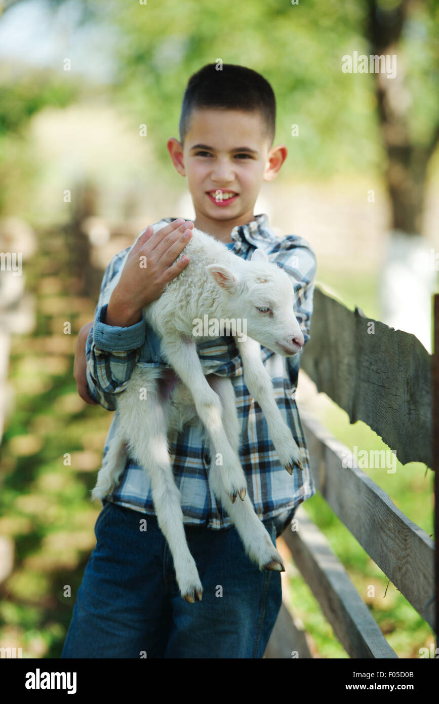 Child hug lamb hi-res stock photography and images - Alamy